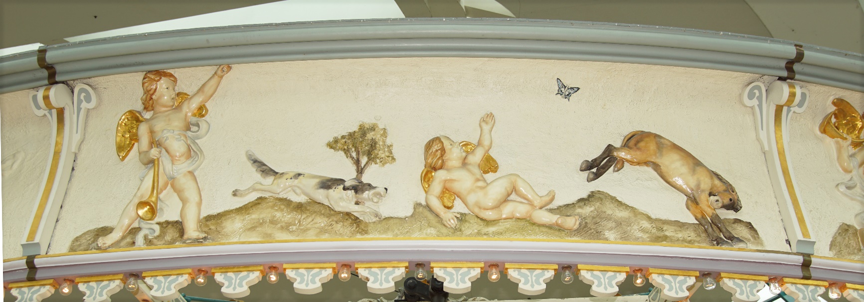 A picture containing floor, indoor, carousel, rideDescription ...